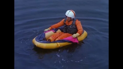 Pilot seated in one man raft gets out an... | Stock Video | Pond5