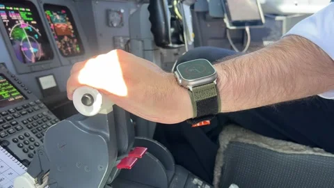 Pilot wearing an Apple Watch Ultra in th... | Stock Video | Pond5