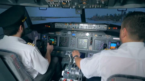 Pilots control an airbus in a flight sim... | Stock Video | Pond5