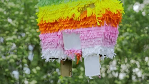 Pinata after it was beaten and candy was... | Stock Video | Pond5