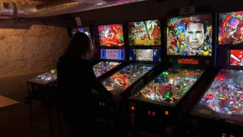 Pinball - Man Playing Jurassic Park Pin... | Stock Video | Pond5