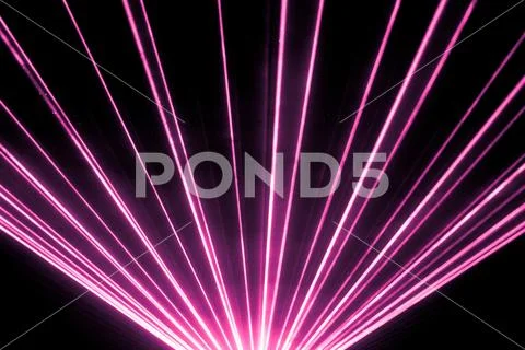 Pink laser show nightlife club stage and shining sparkling rays. Luxury ...