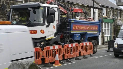 Pipe laying roadworks. Truck reversing b... | Stock Video | Pond5