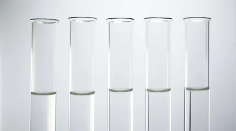 A pipette drips transparent water into a... | Stock Video | Pond5