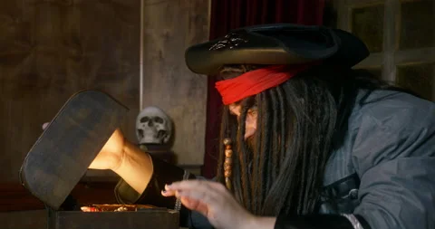 Pirate opens treasure chest to take gold... | Stock Video | Pond5