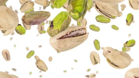 Pistachios (whole and kernels) falling d... | Stock Video | Pond5