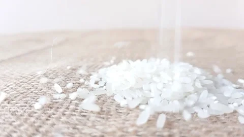 plain white rice on a brown table | Stock Video | Pond5