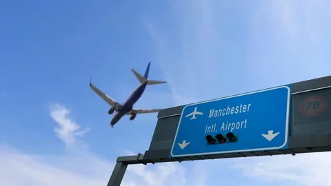 plane flying over manchester airport sig... | Stock Video | Pond5