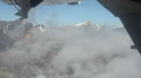 plane flying through the Andes / Peru | Stock Video | Pond5