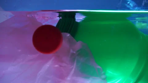 Plastic Bags and Bottles Floating in Wat... | Stock Video | Pond5