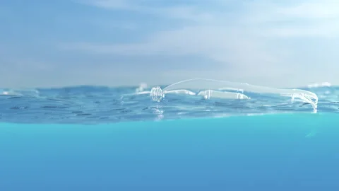 Plastic bottles float on ocean waves loo... | Stock Video | Pond5