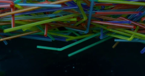 Plastic Colourful Straws Floating In The... | Stock Video | Pond5