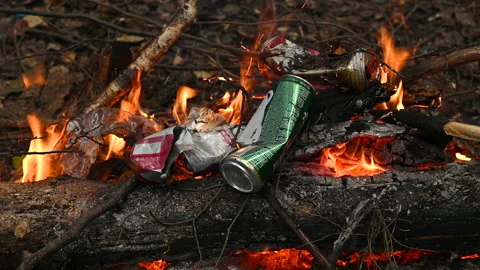 plastic garbage burning in bonfire. | Stock Video | Pond5
