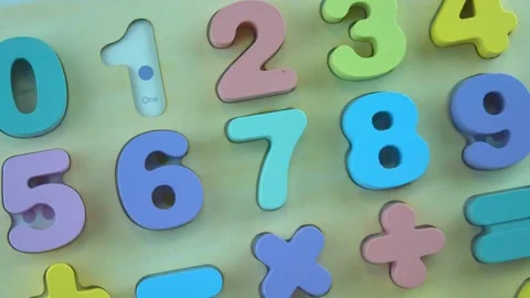 Plastic multi-colored numbers and letter... | Stock Video | Pond5