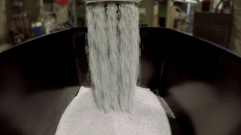Plastic pellets falling into a metal con... | Stock Video | Pond5