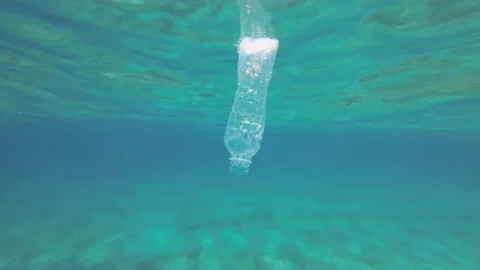Plastic pollution, plastic bottle in blu... | Stock Video | Pond5