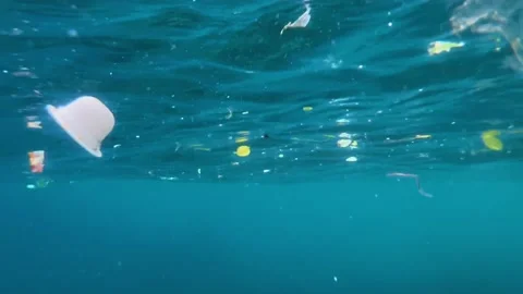 Plastic waste floating on surface of oce... | Stock Video | Pond5