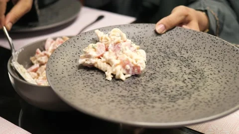 plate of cream and herb pasta on table | Stock Video | Pond5