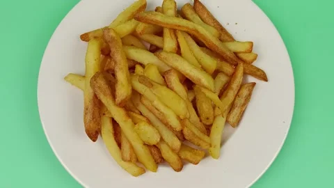 plate of fries, top view, isolated on a ... | Stock Video | Pond5