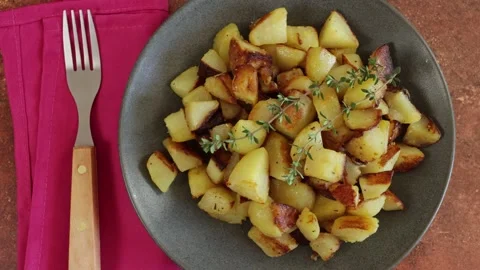 plate of hash browns close-up, on a tabl... | Stock Video | Pond5