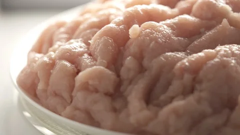 Plate with raw ground chicken meat rotat... | Stock Video | Pond5