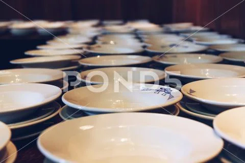 Plates lined up for dinner at The Great Hall of Christ Church College ...