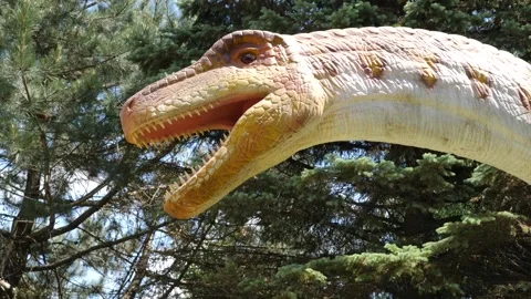 Platesaurus dinosaur model in the wild. ... | Stock Video | Pond5