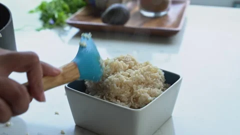 Plating of brown rice cook a meal two ca... | Stock Video | Pond5