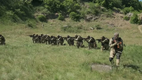 A platoon of soldiers changing positions... | Stock Video | Pond5