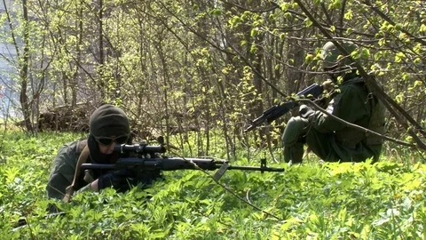 Players of airsoft is in position in the... | Stock Video | Pond5