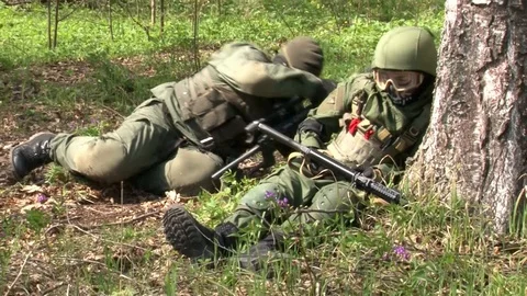 Players of airsoft is in position in the... | Stock Video | Pond5