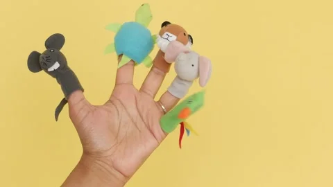 Playful finger puppets tell stories on a... | Stock Video | Pond5
