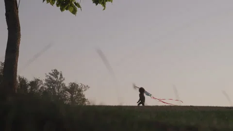 Playful little boy flying kite on hill, ... | Stock Video | Pond5