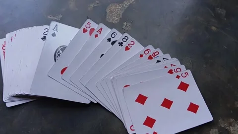 playing cards on a cement floor backgrou... | Stock Video | Pond5