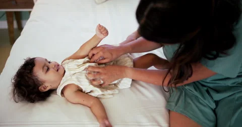 Playing, mother and tickle baby on bed f... | Stock Video | Pond5