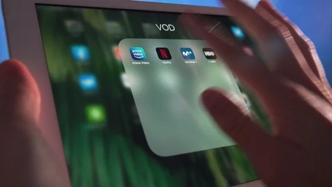 Playing a netflix series on a tablet. | Stock Video | Pond5