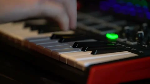 Playing piano chords on small mini MIDI ... | Stock Video | Pond5