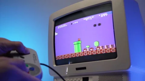 Playing a Vintage Mario Bros Video Game ... | Stock Video | Pond5