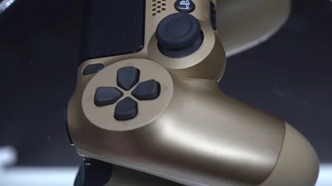 Playstation 4 Dual Shock Controller, Gol... | Stock Video | Pond5