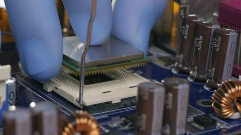 Plug in CPU microprocessor to motherboar... | Stock Video | Pond5