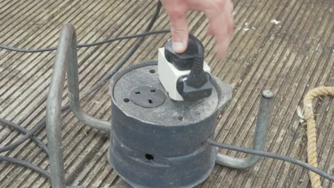 Plugging a Type G plug into an electrica... | Stock Video | Pond5