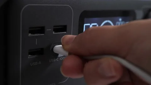 Plugging USB-C into Power Station with D... | Stock Video | Pond5
