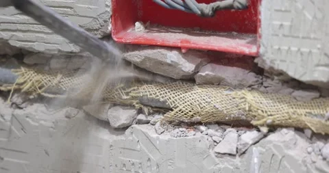 Plumber using a jackhammer to drill into... | Stock Video | Pond5