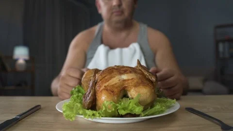 Plump male eating fatty fried chicken hu... | Stock Video | Pond5