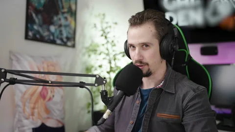 Podcast host talking into camera with 2D... | Stock Video | Pond5