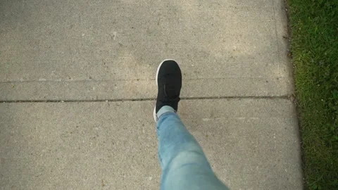 Point of View. Looking down at feet walk... | Stock Video | Pond5