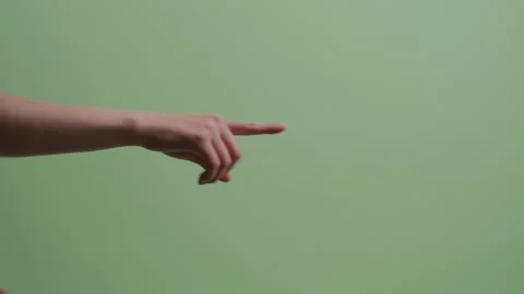 Pointing Finger in Front of Green Backdr... | Stock Video | Pond5