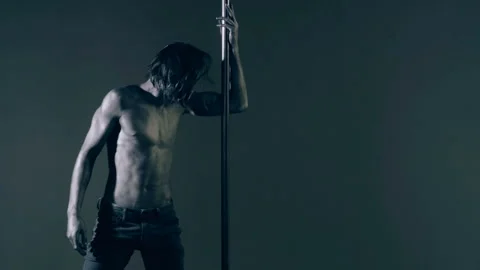 Pole dancer. Guy does gymnastic exercise... | Stock Video | Pond5