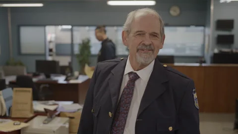 Police captain smiling at the camera wit... | Stock Video | Pond5
