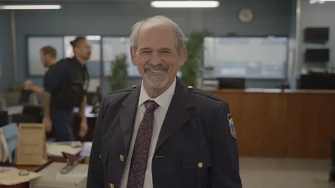 Police captain smiling at the camera in ... | Stock Video | Pond5